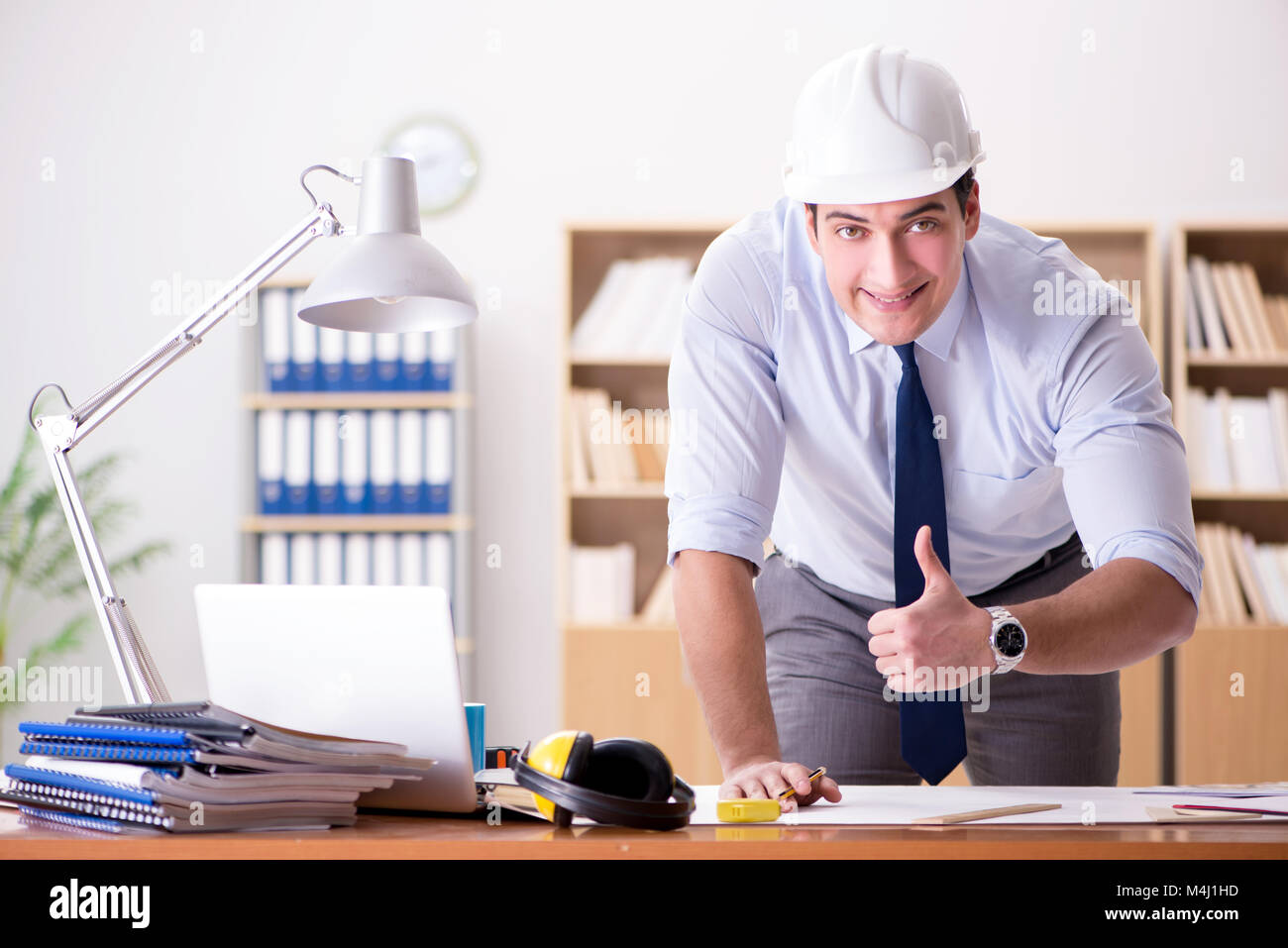 Engineer supervisor working on drawings in the office Stock Photo - Alamy