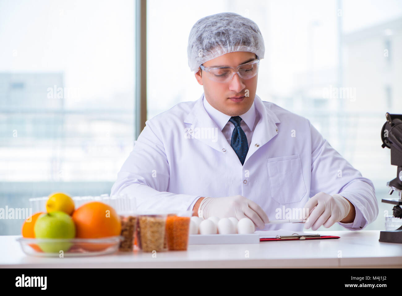 Nutrition expert testing food products in lab Stock Photo - Alamy