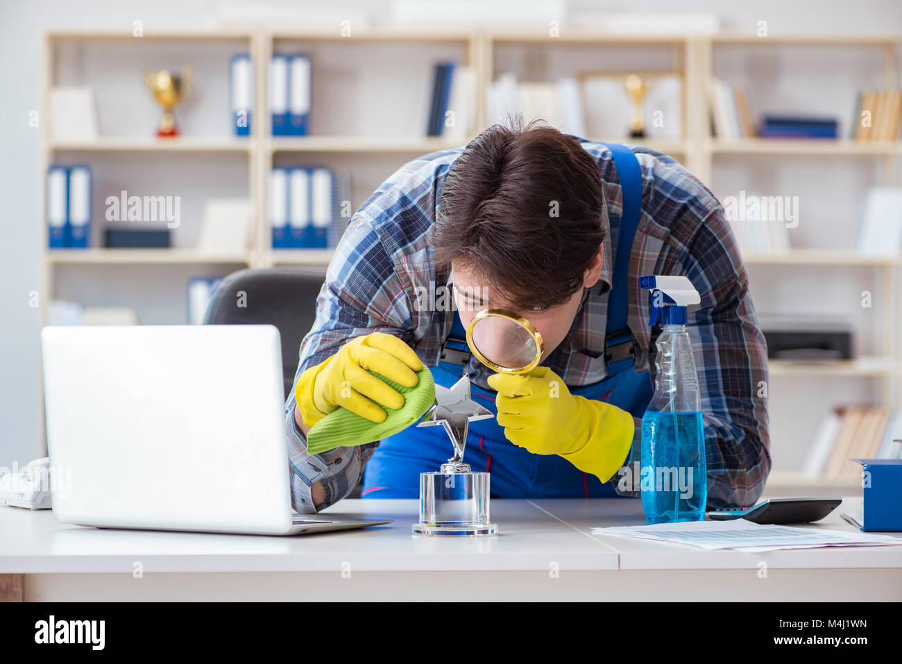 Male cleaner working in the office Stock Photo - Alamy