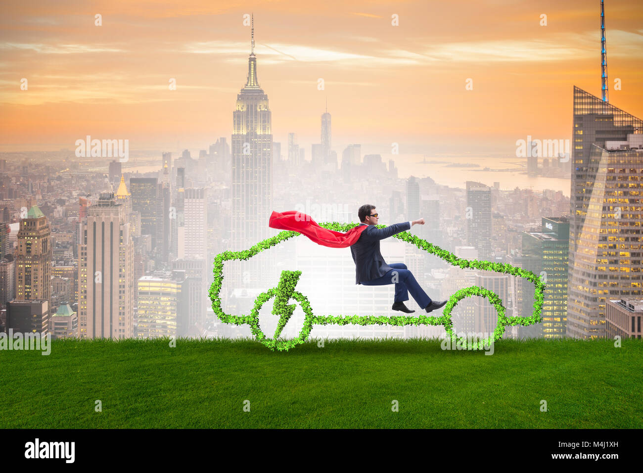 Electric car concept in green environment concept Stock Photo - Alamy