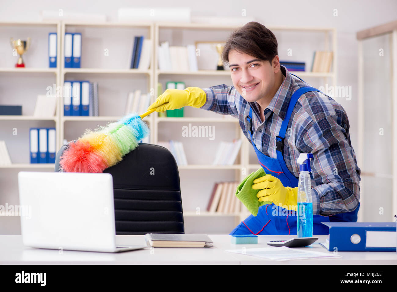 Male cleaner working in the office Stock Photo - Alamy