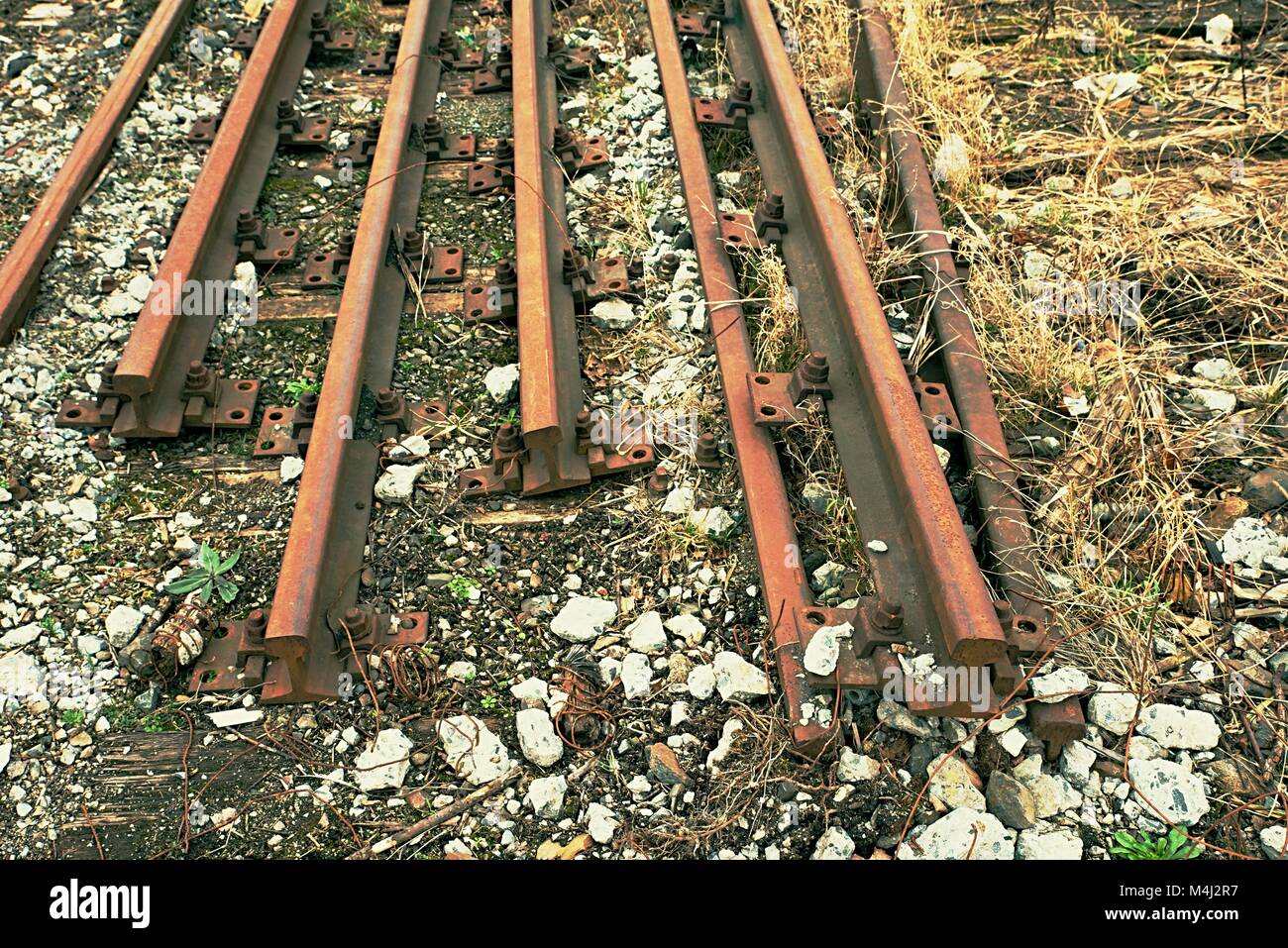 Old rusty railways. Railway details of rails joint with screws and nuts ...