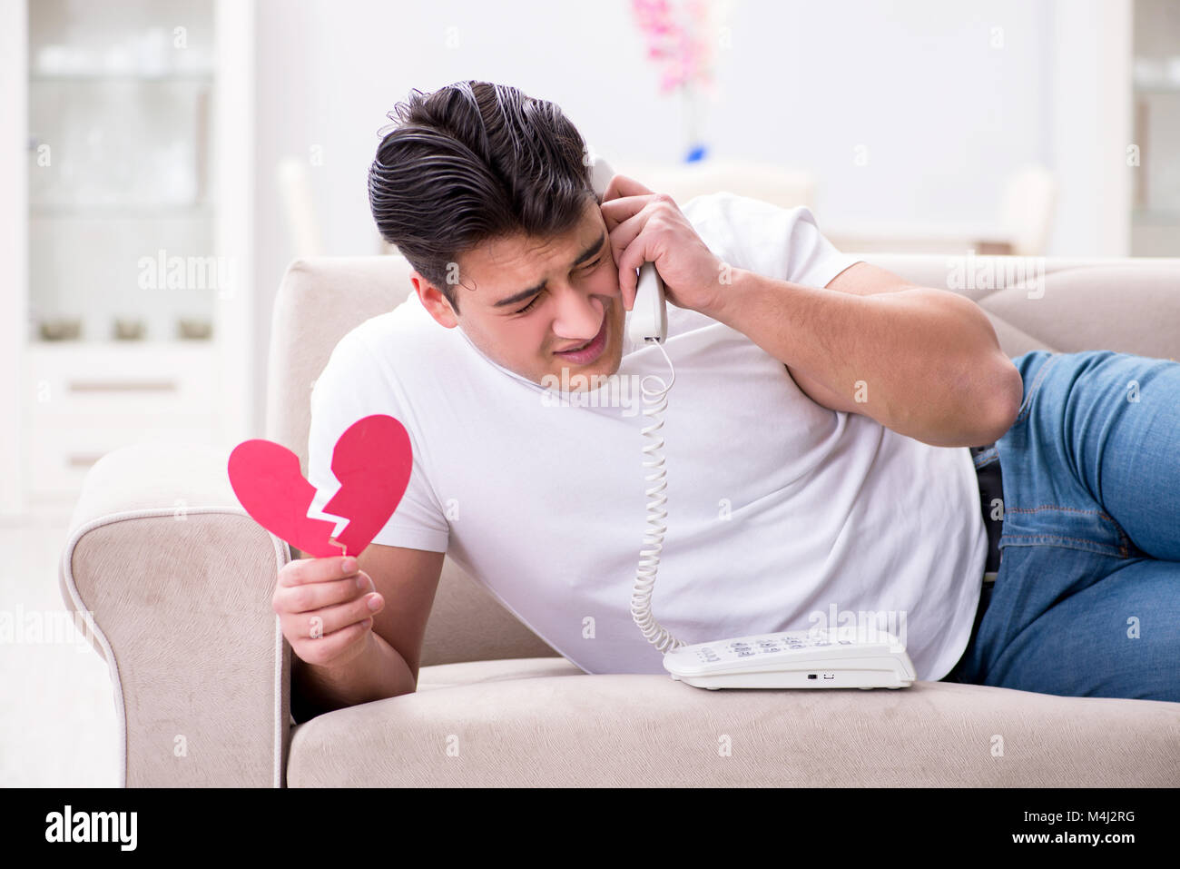 Young man in sad saint valentine concept Stock Photo - Alamy