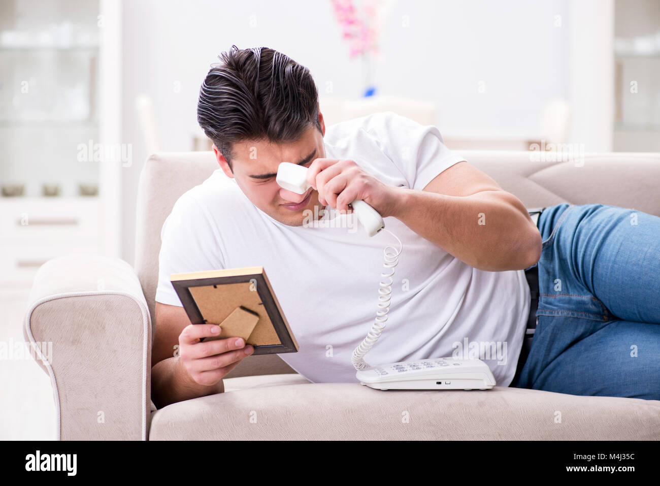 Young man in sad saint valentine concept Stock Photo - Alamy
