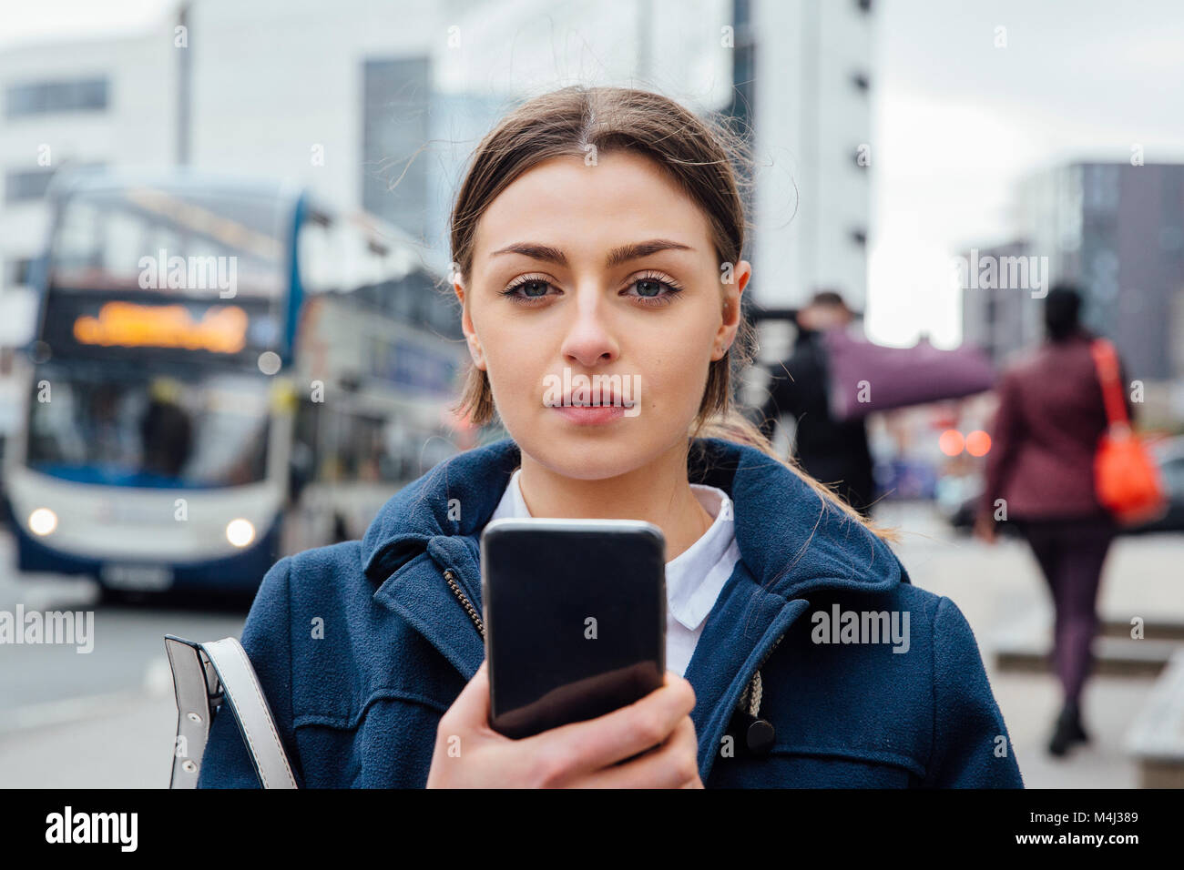 Woman standing looking camera she hi-res stock photography and images ...