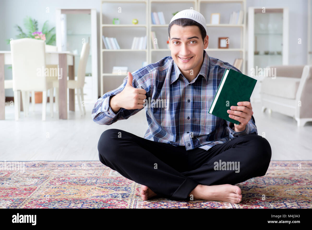 Muslim man praying at home Stock Photo - Alamy