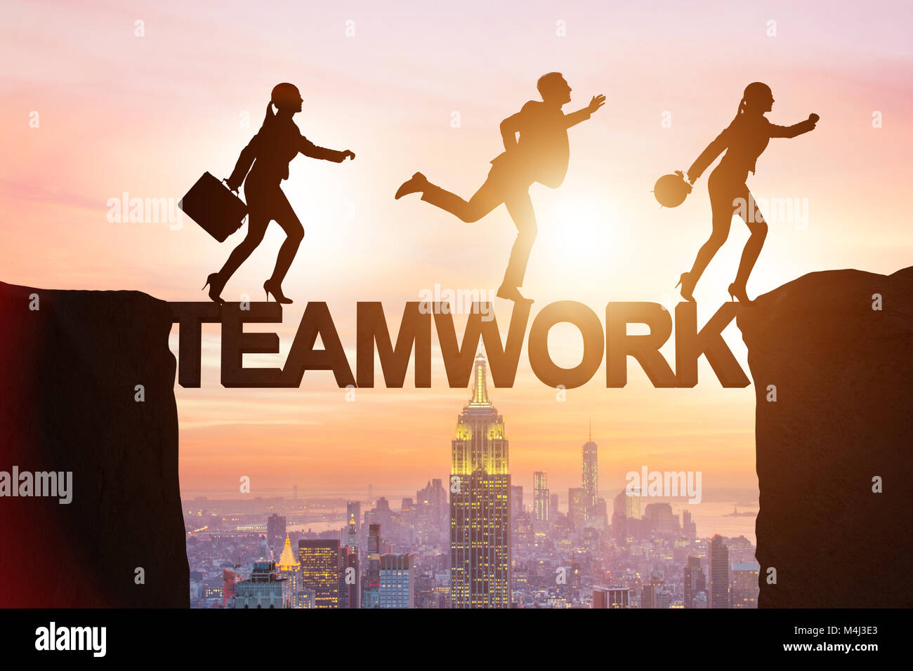 Teamwork concept with business people crossing bridge Stock Photo - Alamy