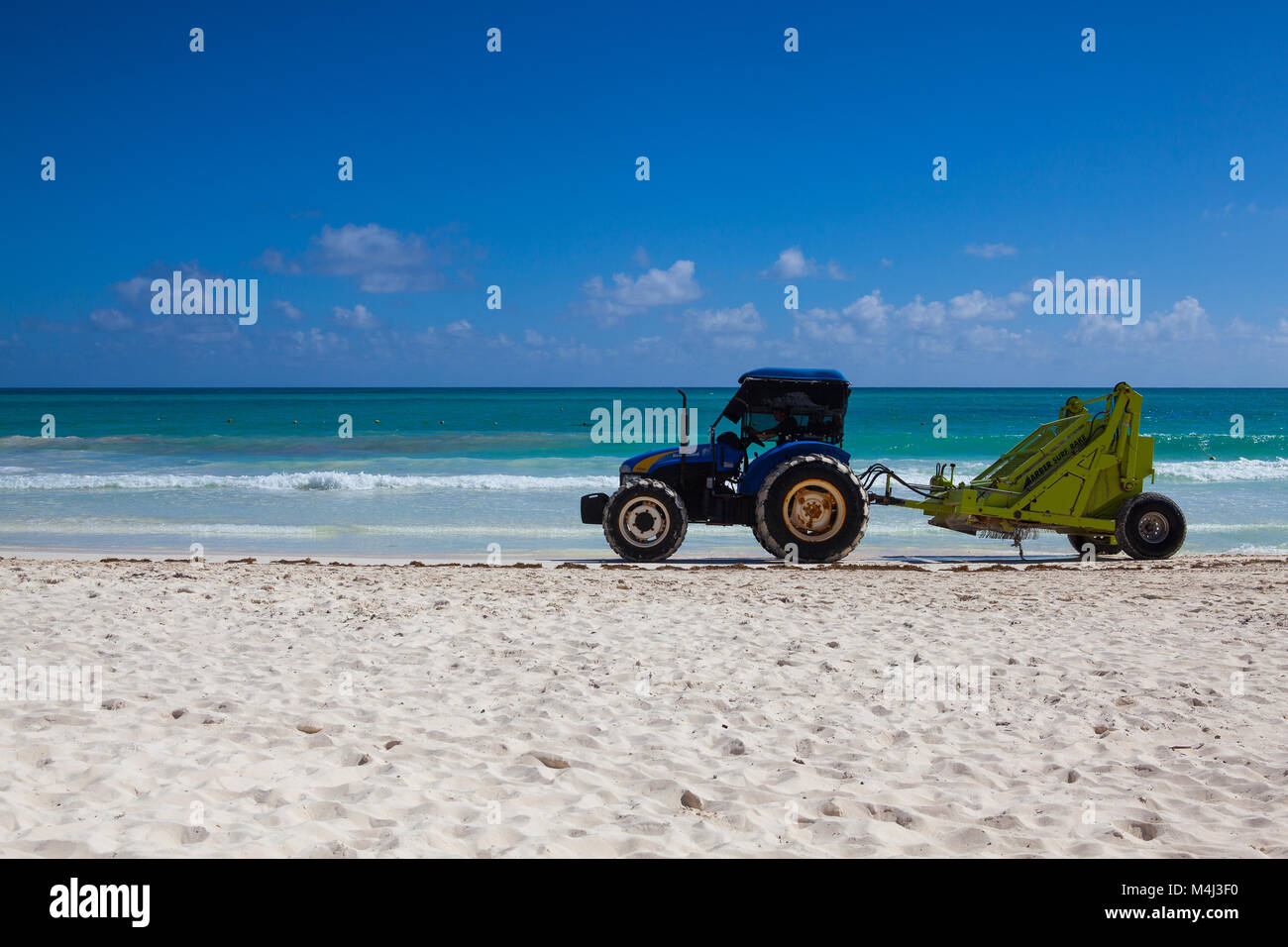 Playa del Carmen, Mexico - February 5,2018: Tractor cleaning the beach ...