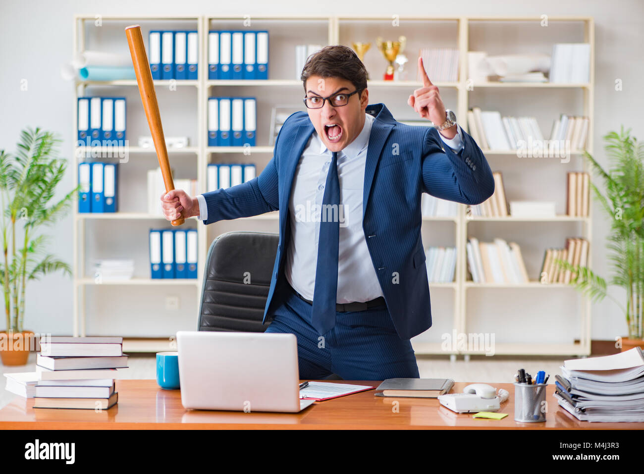 Angry aggressive businessman in the office Stock Photo - Alamy
