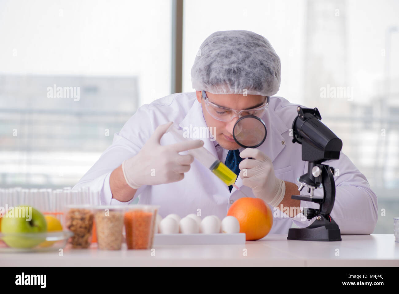 Nutrition expert testing food products in lab Stock Photo - Alamy