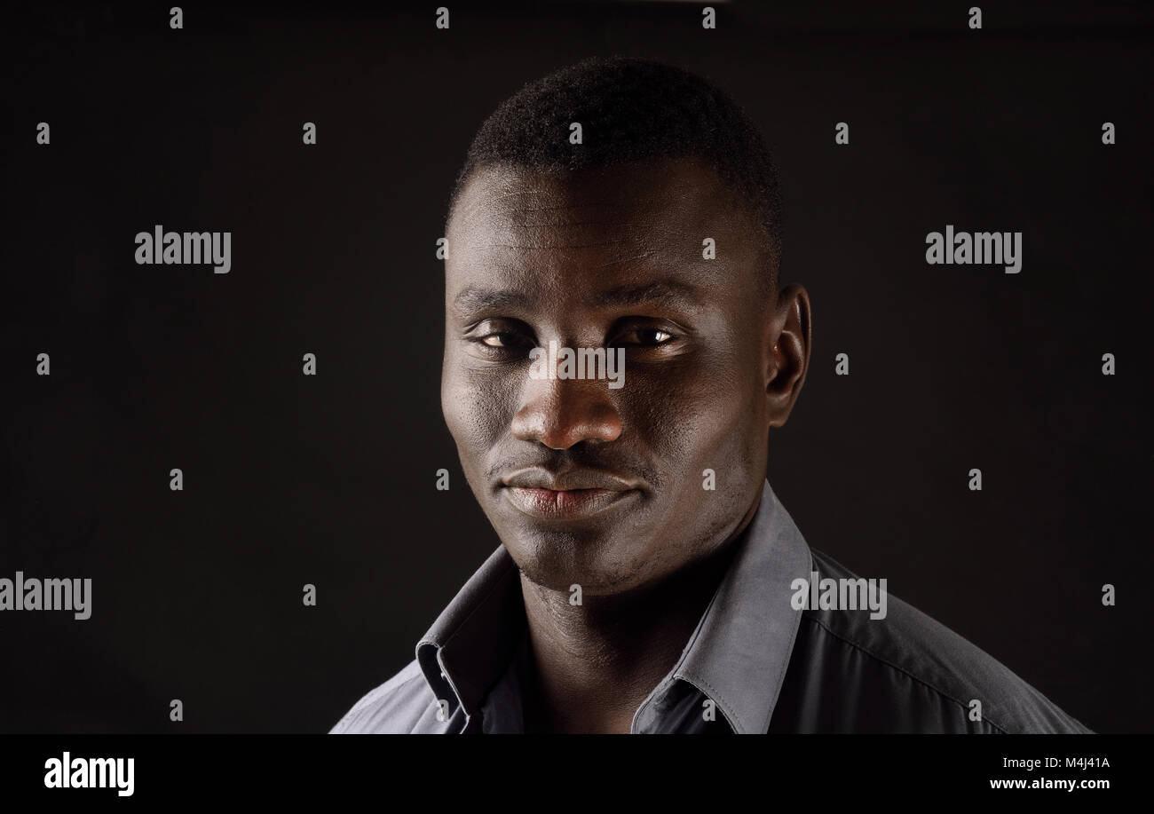portrait of a african man on black Stock Photo - Alamy
