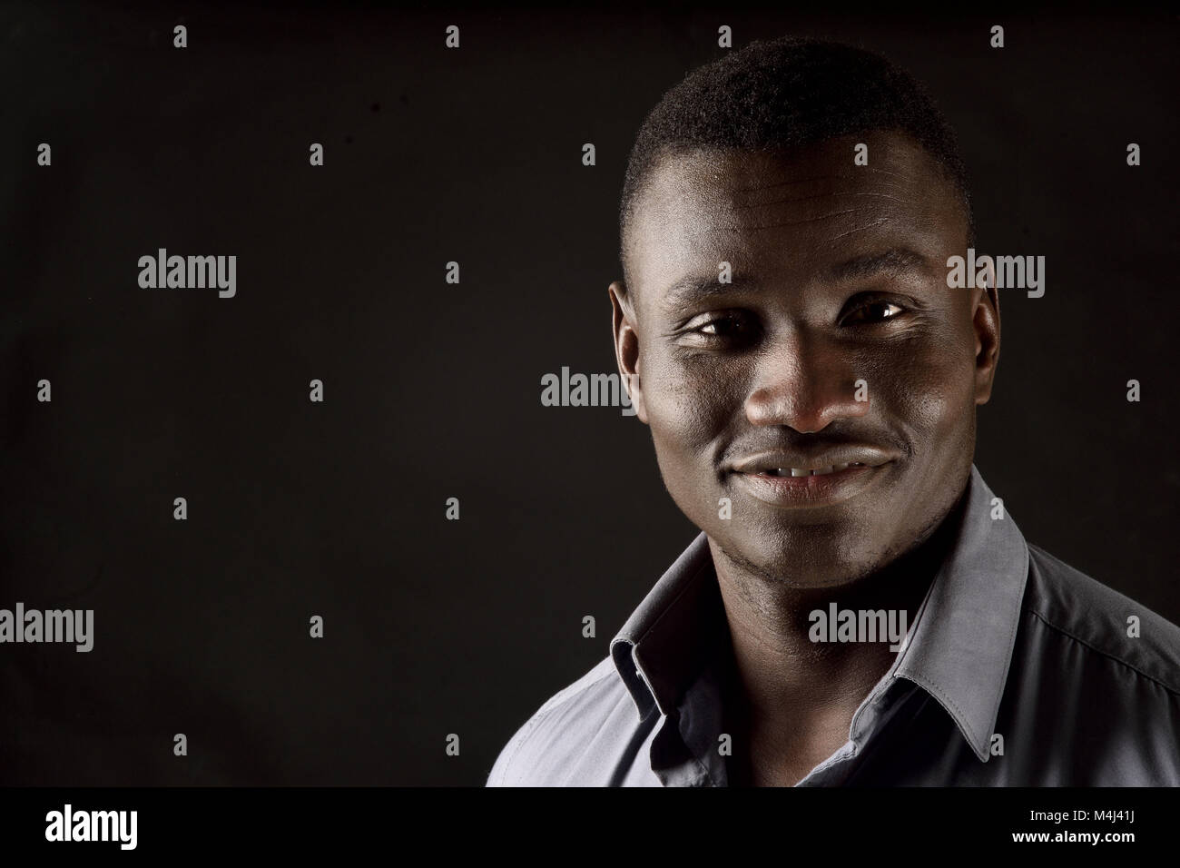 portrait of a african man on black Stock Photo - Alamy