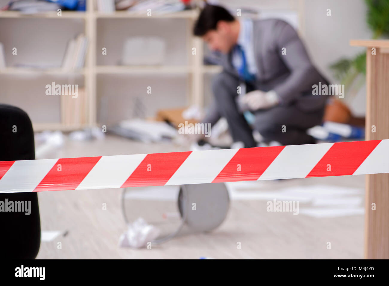 Young man during crime investigation in office Stock Photo - Alamy