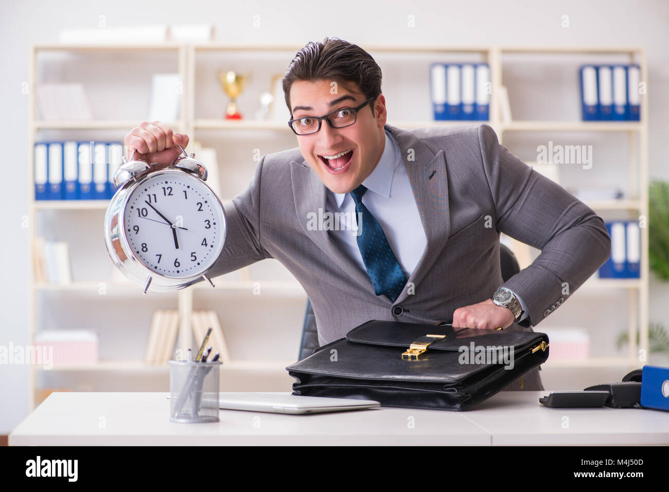 Businessman rushing in the office Stock Photo - Alamy