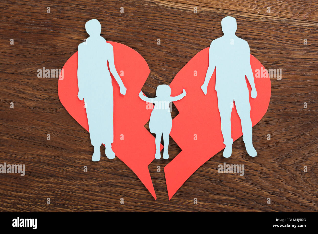 Broken Heart Concept With Family Paper Cut On Wooden Desk Stock Photo ...