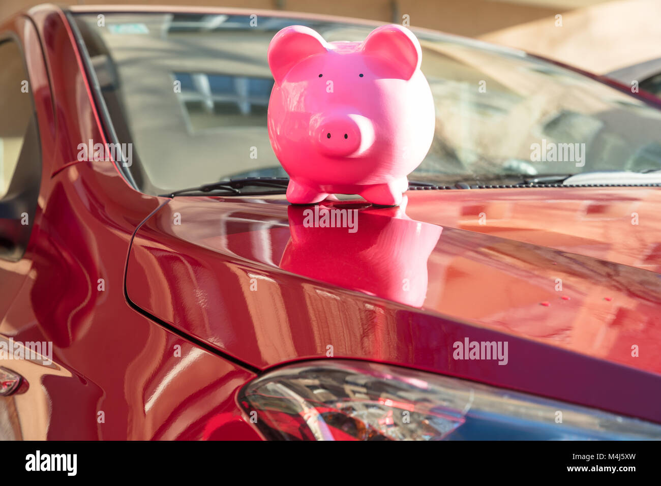 Close-up Of A Piggybank On New Car Stock Photo - Alamy
