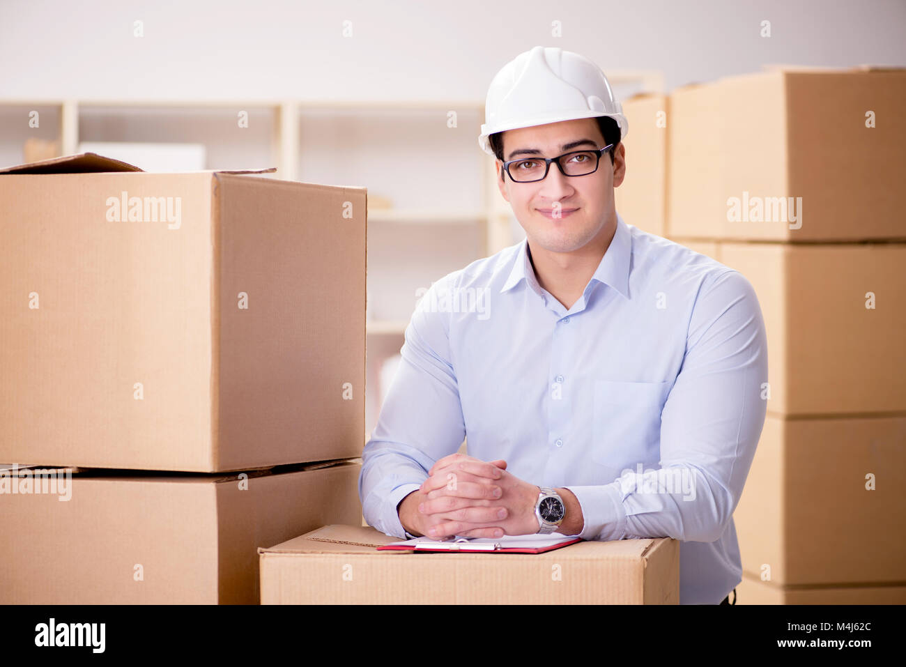 Man working in box delivery relocation service Stock Photo - Alamy