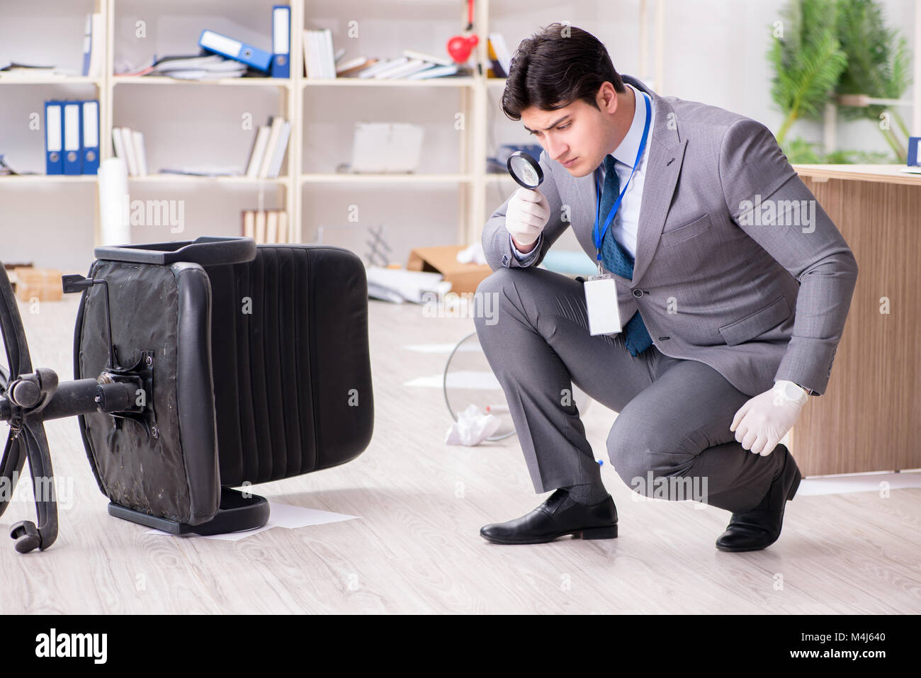 Young man during crime investigation in office Stock Photo - Alamy