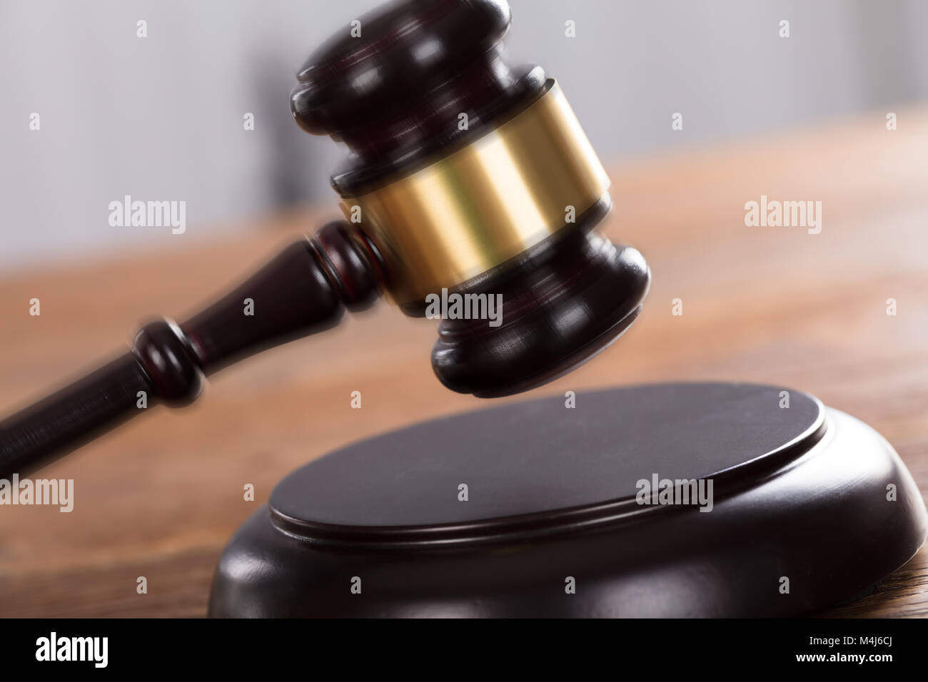 Close-up Of A Gavel Striking On Wooden Desk In A Courtroom Stock Photo ...