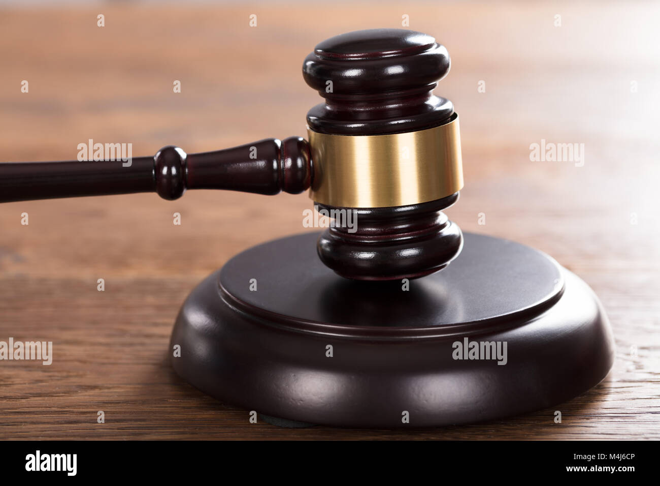 Close-up Of A Gavel Striking On Wooden Desk In A Courtroom Stock Photo ...