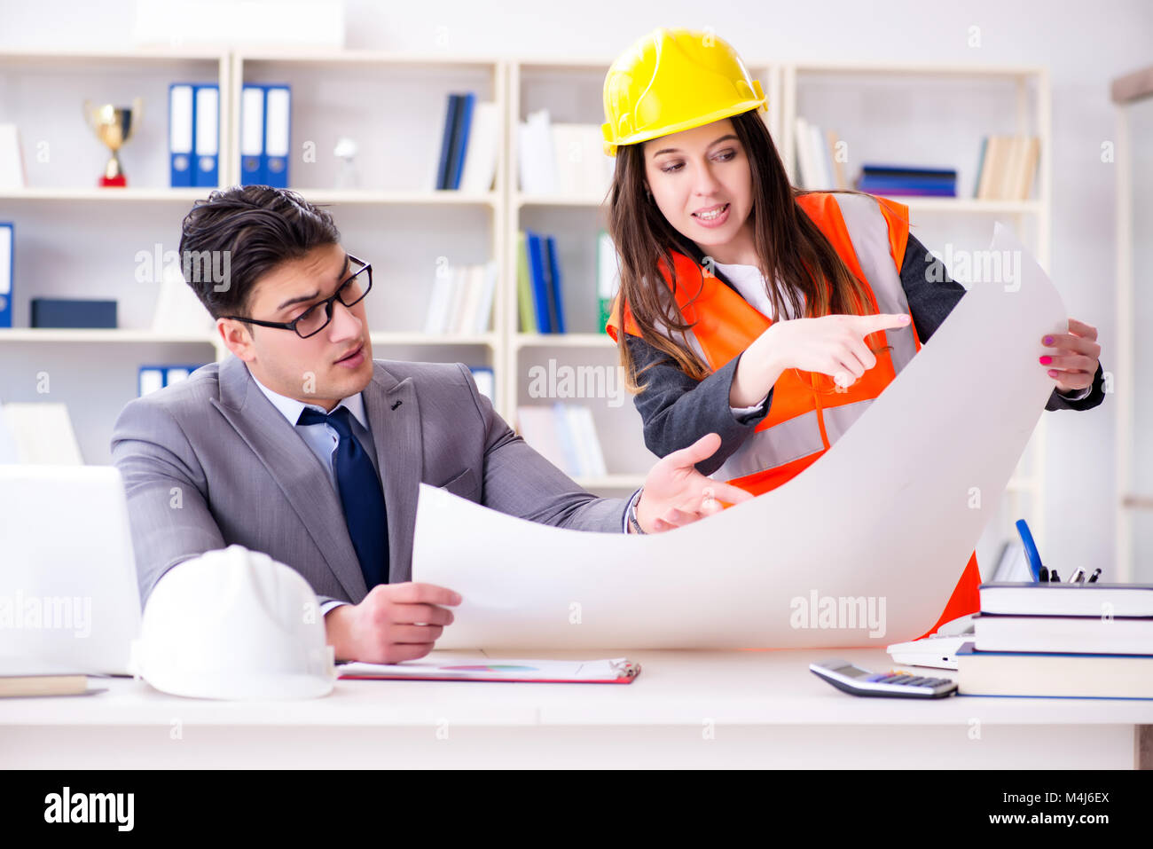 Reviewing architectural drawings hi-res stock photography and images ...
