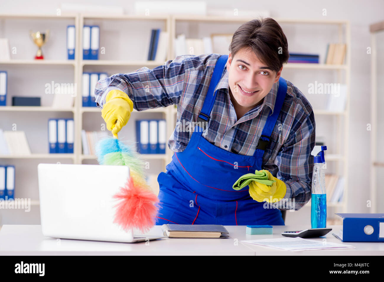 Male cleaner working in the office Stock Photo - Alamy