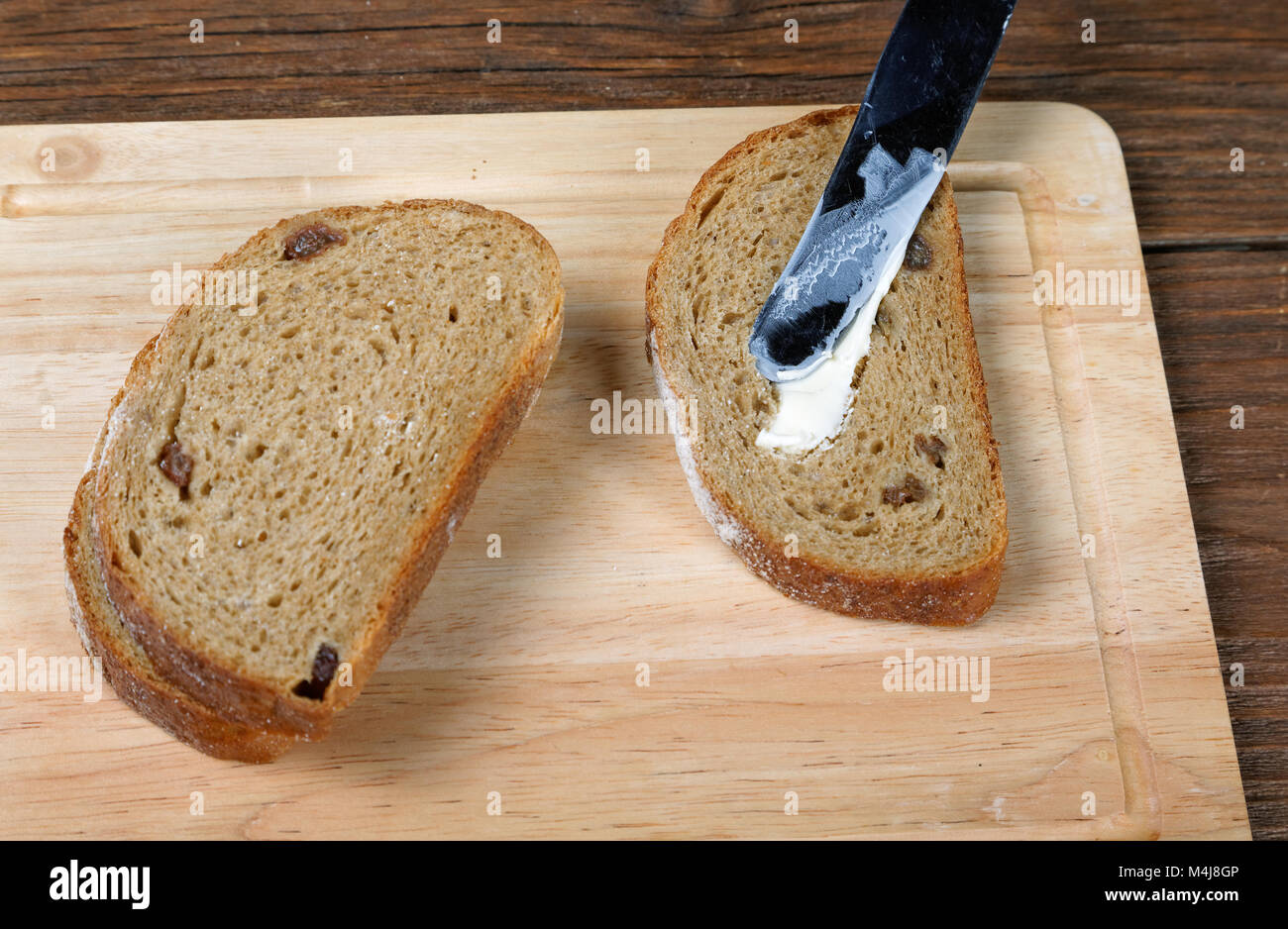 Sliced bread smeared with butter close-up Stock Photo - Alamy