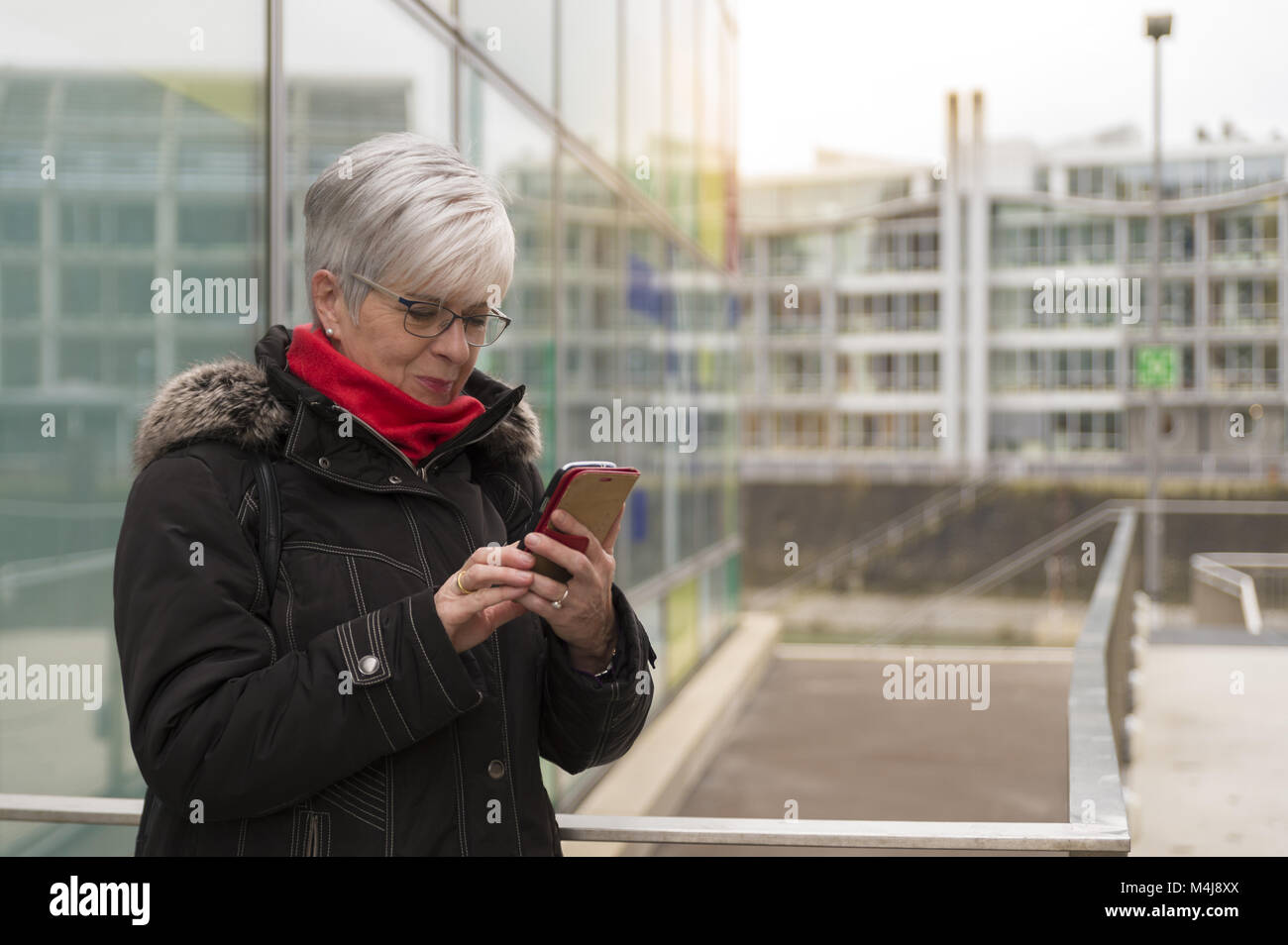 Senior woman with smartphone Stock Photo - Alamy