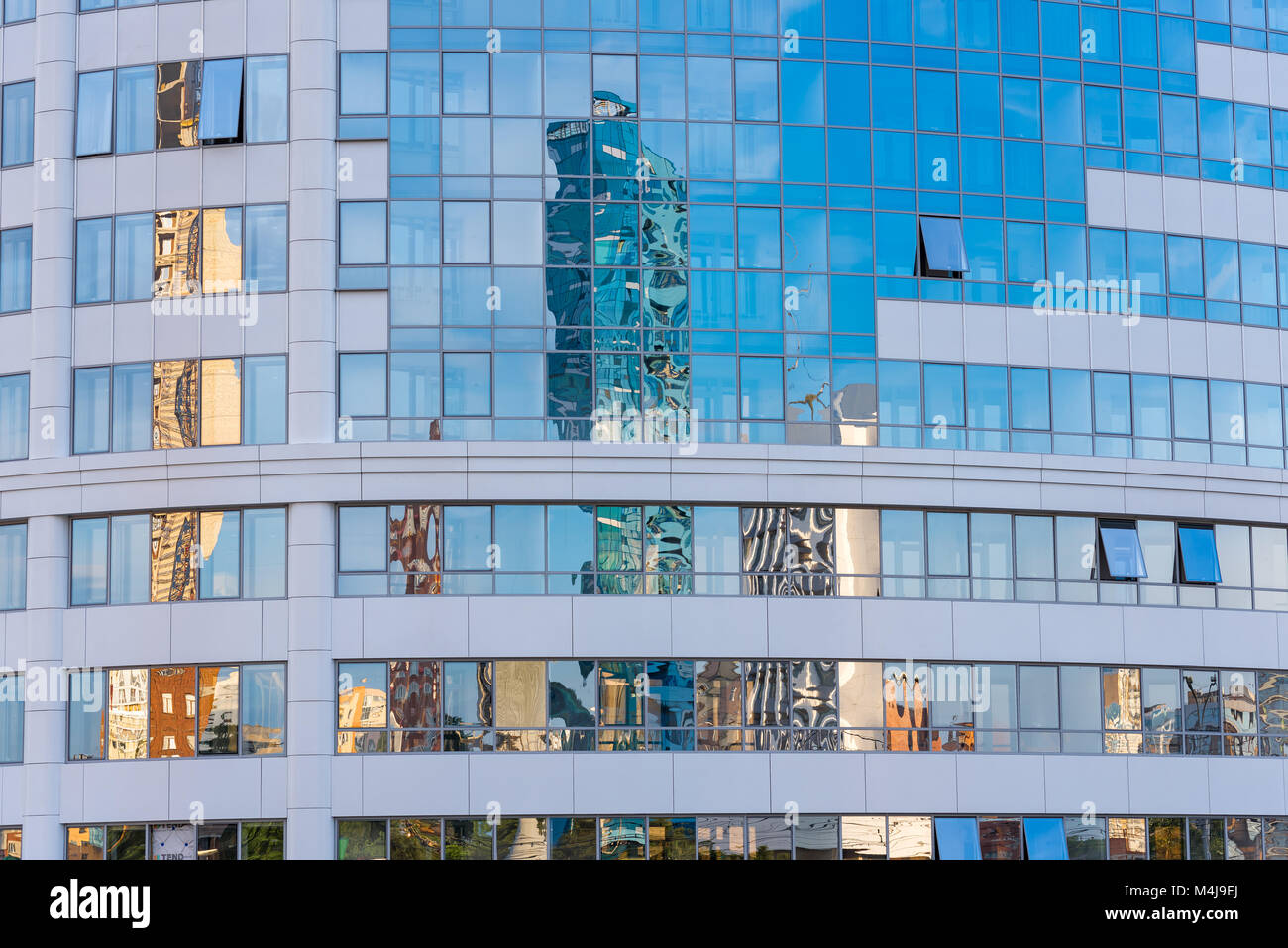 Reflection in the mirror facade of a multi-storey building Stock Photo ...