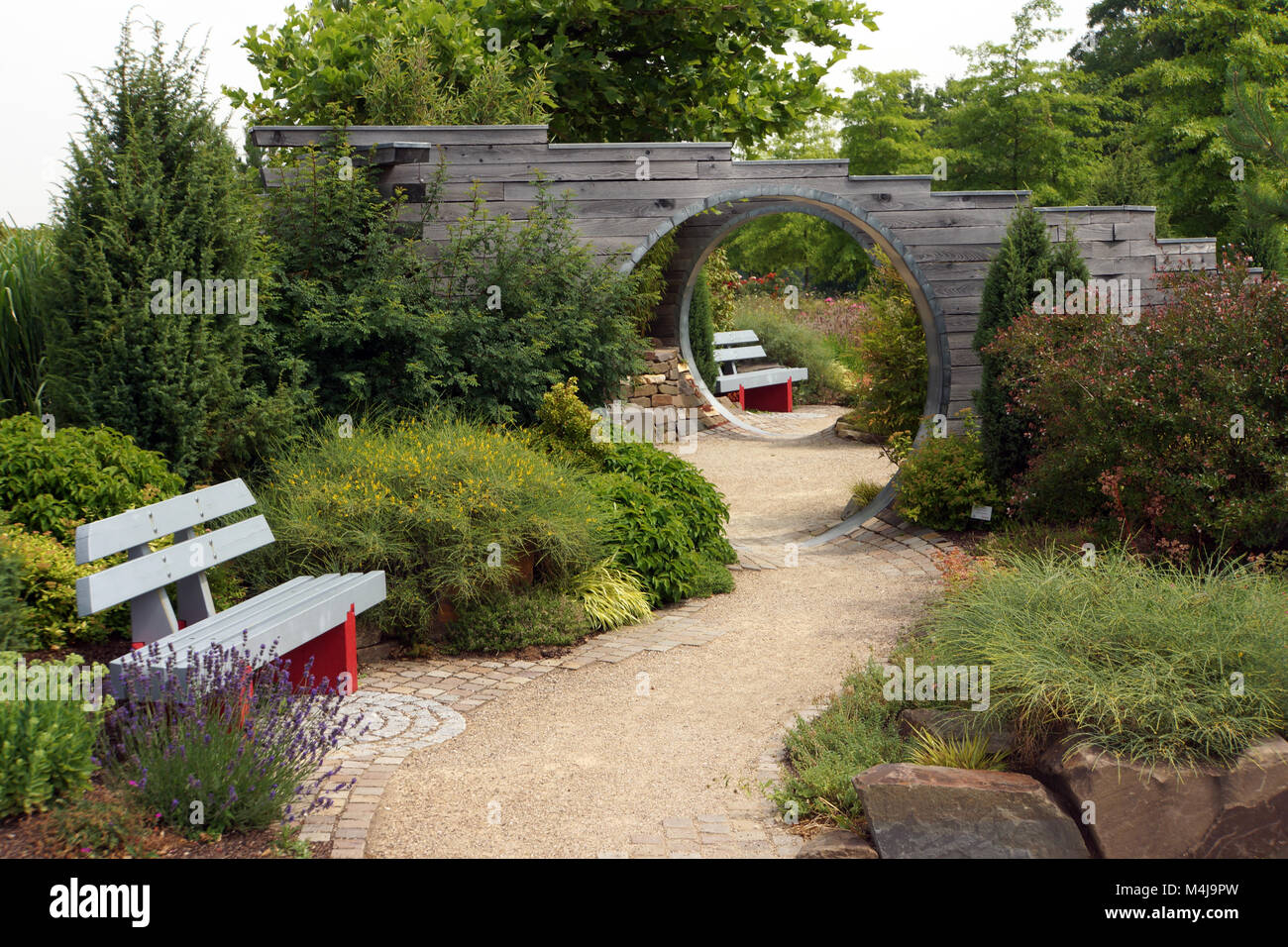 park landscape with bench and passageway Stock Photo - Alamy