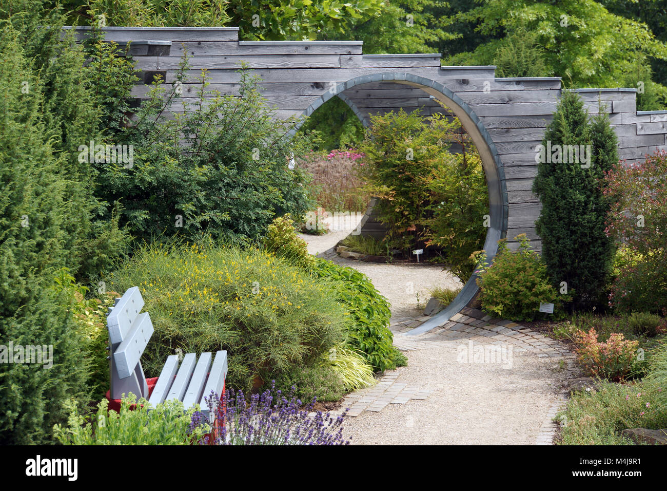 park landscape with bench and passageway Stock Photo - Alamy