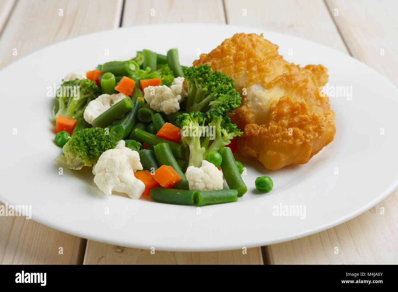 fish fillet in batter with boiled vegetables Stock Photo - Alamy