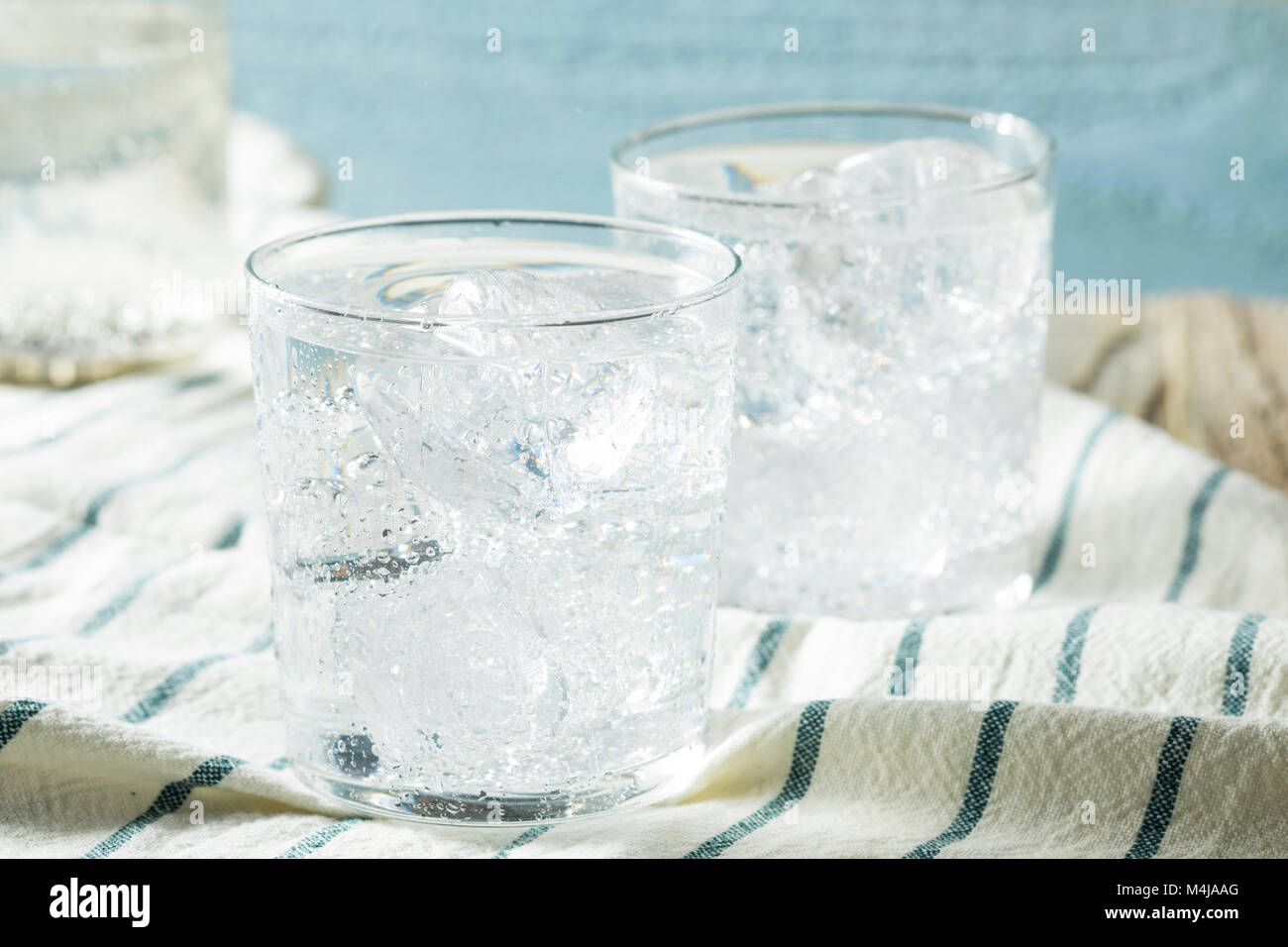Fresh Spring Sparkling Water with Ice in a Glass Stock Photo - Alamy