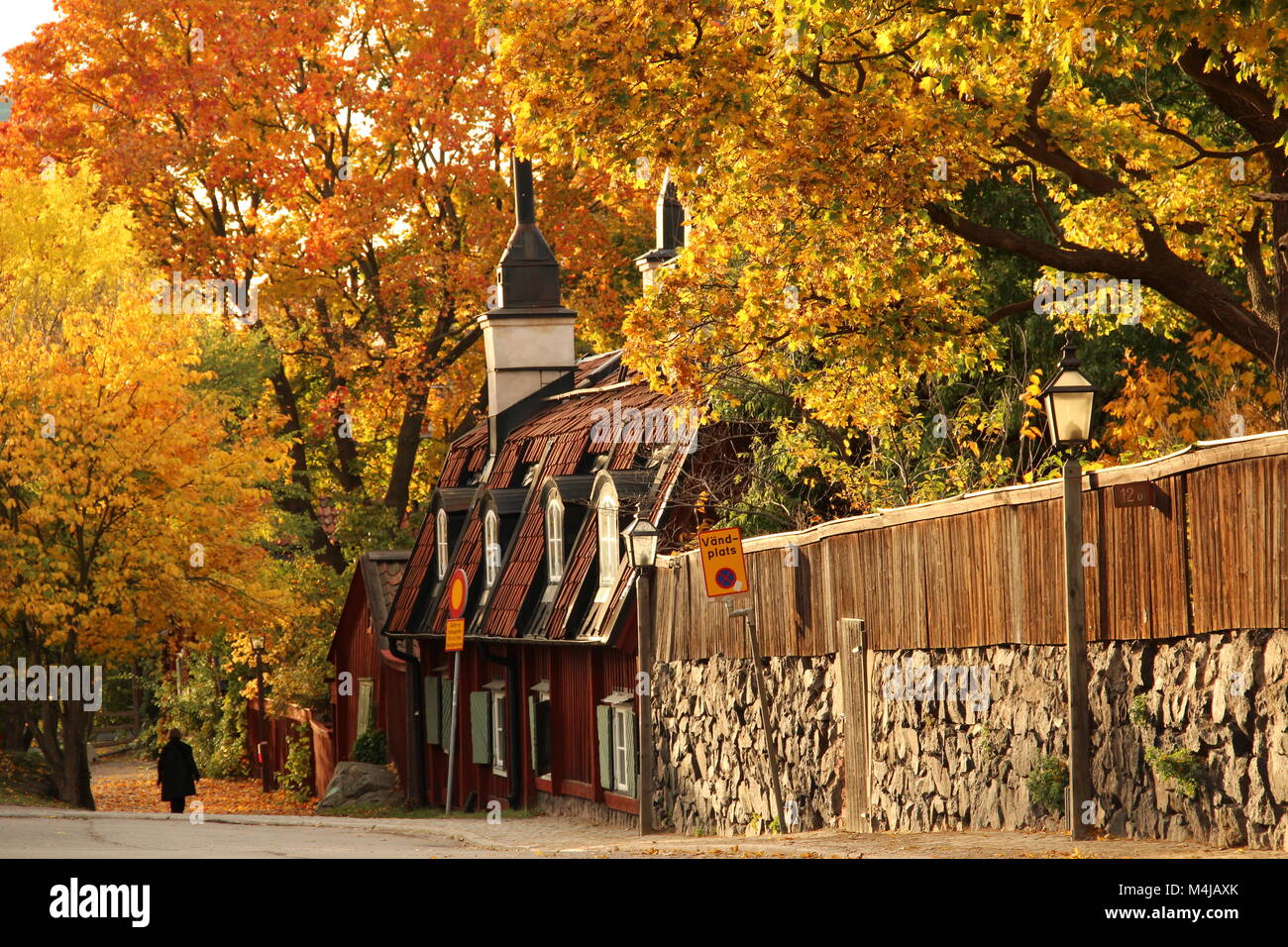 Old red cottages on Södermalm in central Stockholm in autumn colours ...