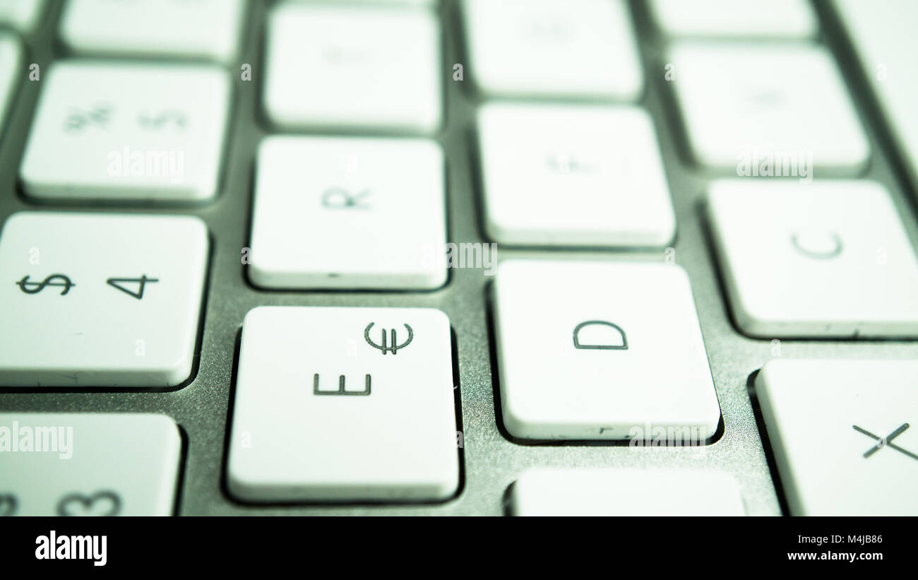 metallic keyboard with white keys Stock Photo - Alamy