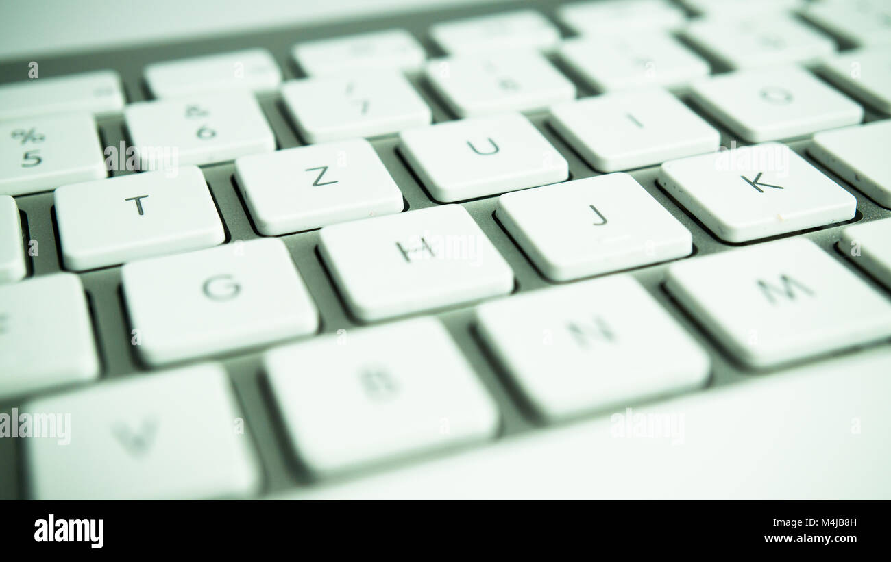 metallic keyboard with white keys Stock Photo - Alamy