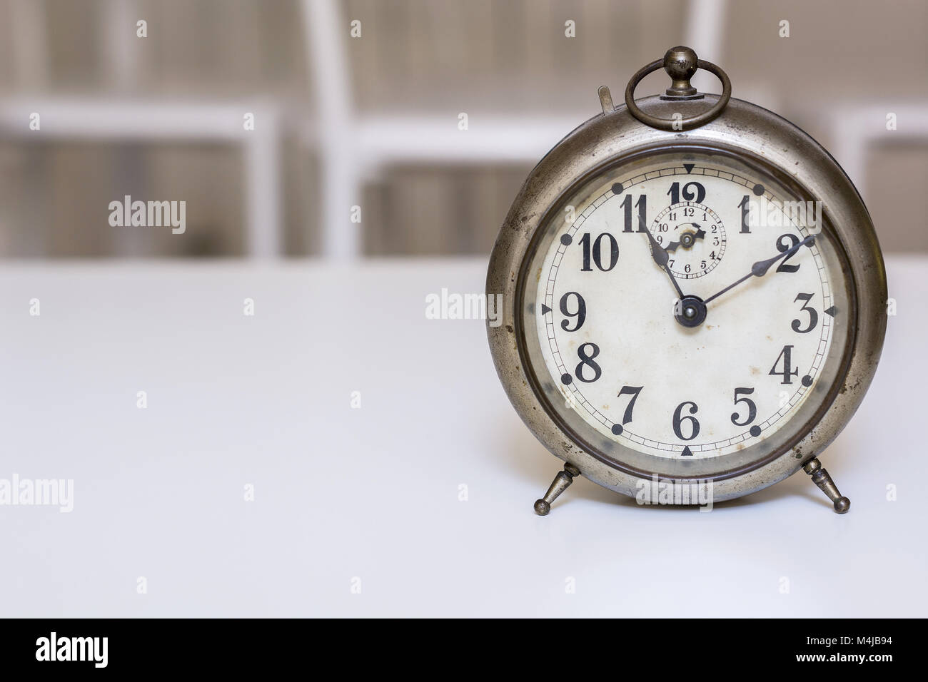 old clock on a white background Stock Photo - Alamy