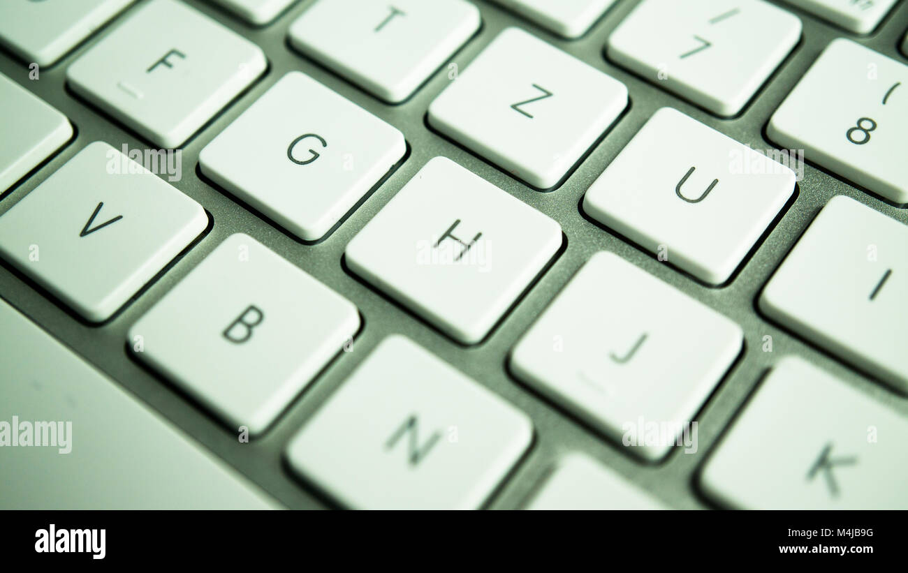 metallic keyboard with white keys Stock Photo - Alamy