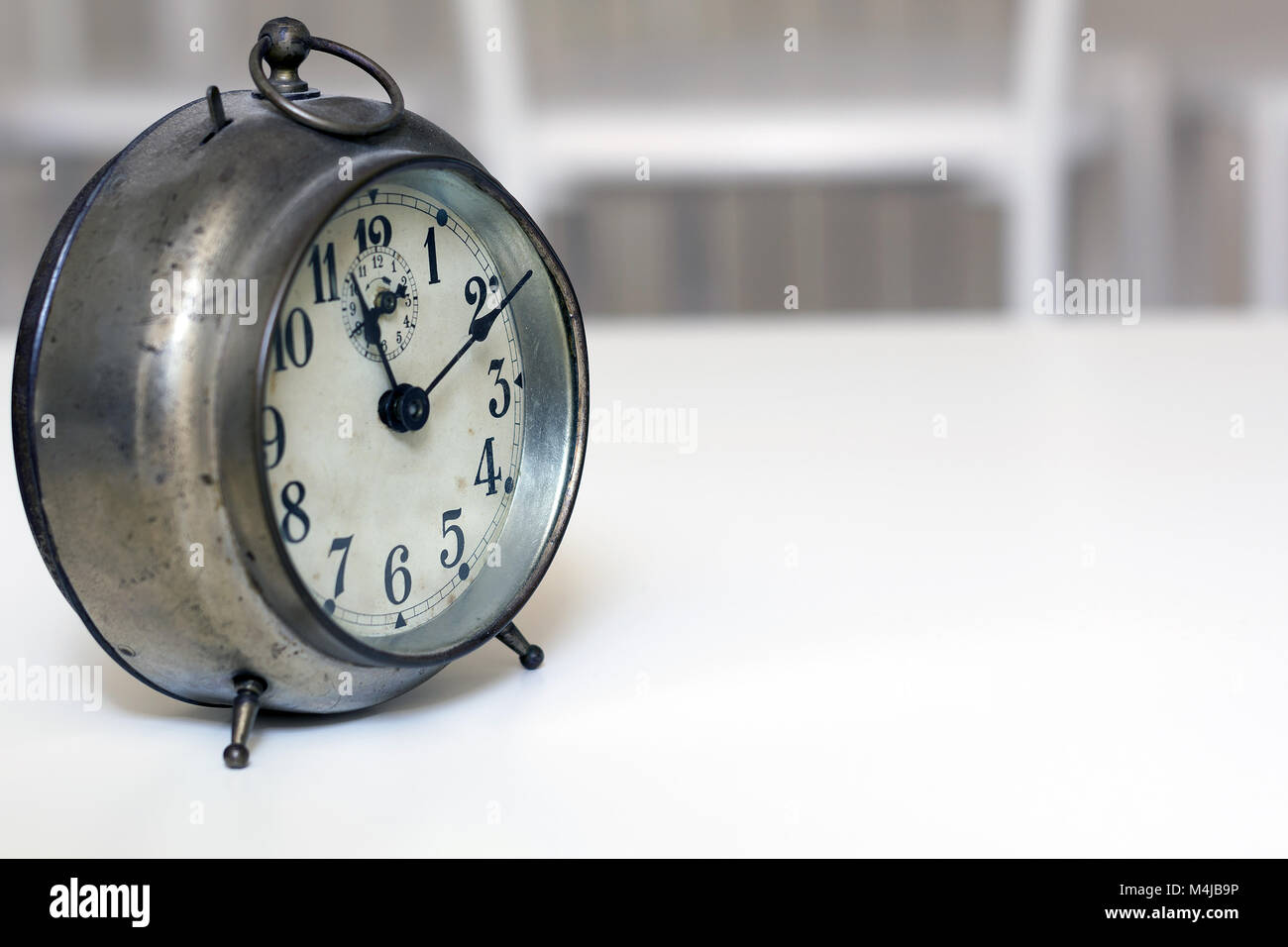 old clock on a white background Stock Photo - Alamy