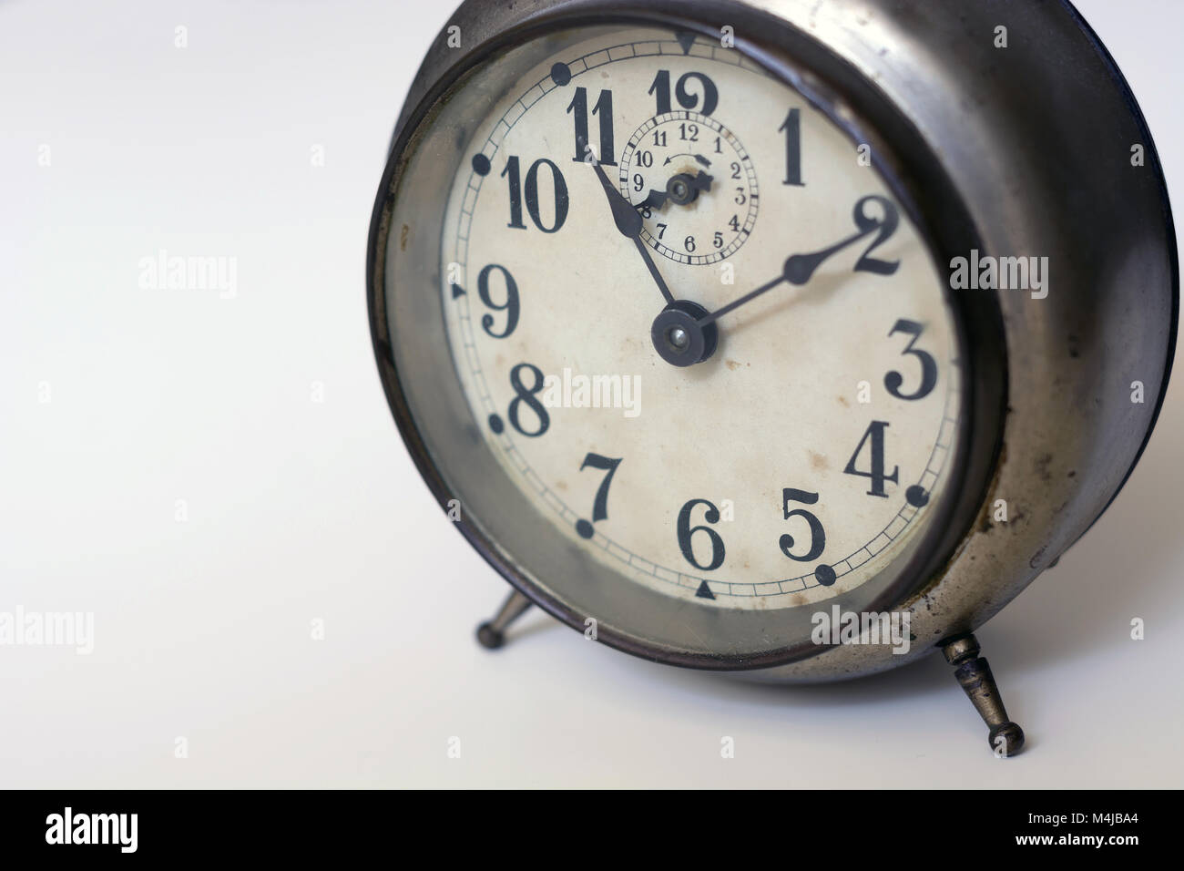 old clock on a white background Stock Photo - Alamy