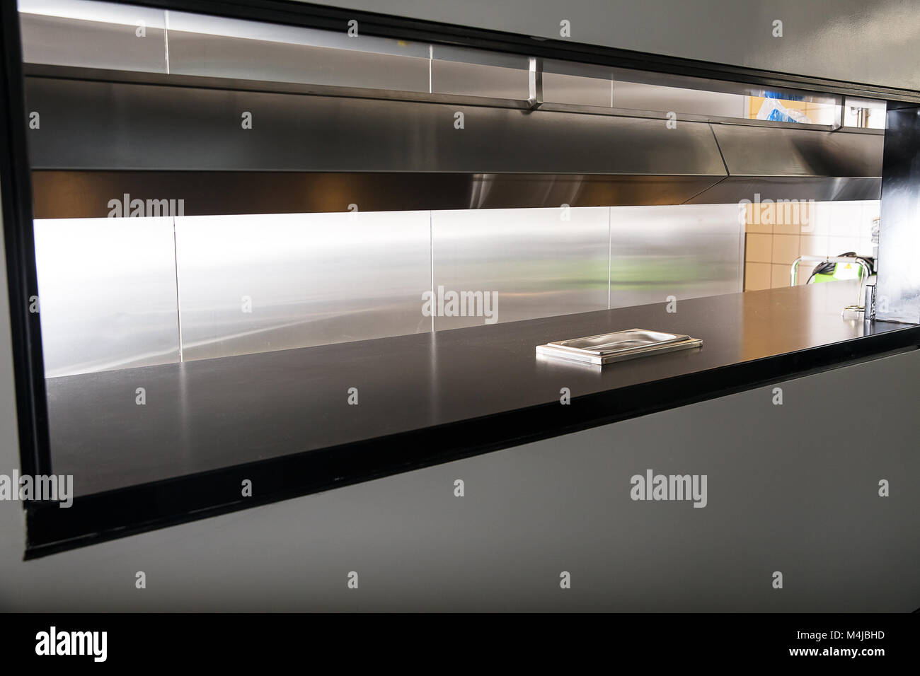 Professional kitchen, view counter in steel Stock Photo - Alamy