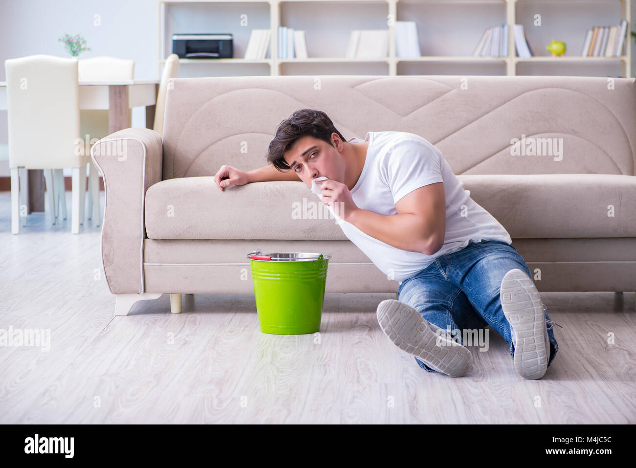 Man vomiting bucket hi-res stock photography and images - Alamy