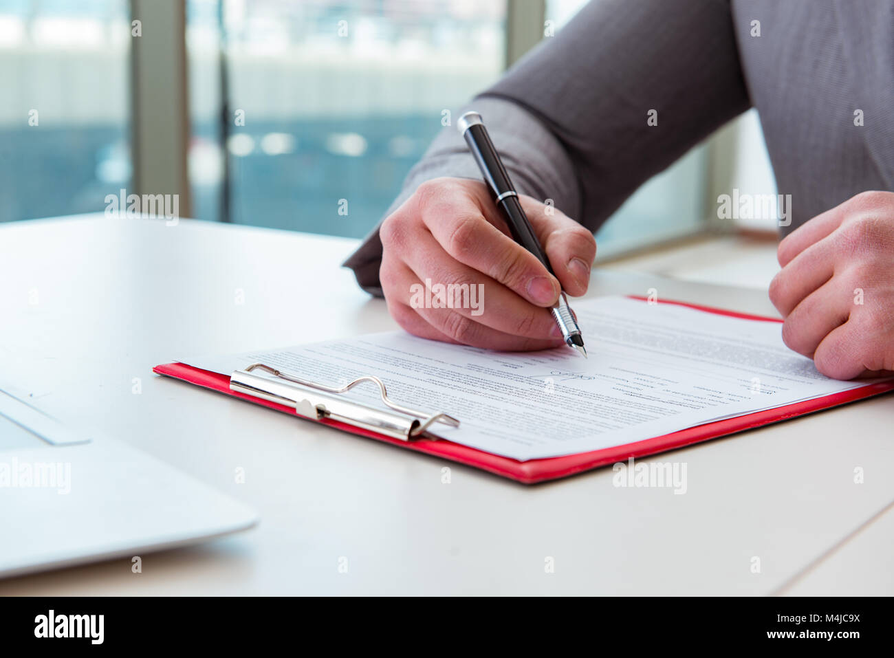 Businessman taking notes at the meeting Stock Photo - Alamy
