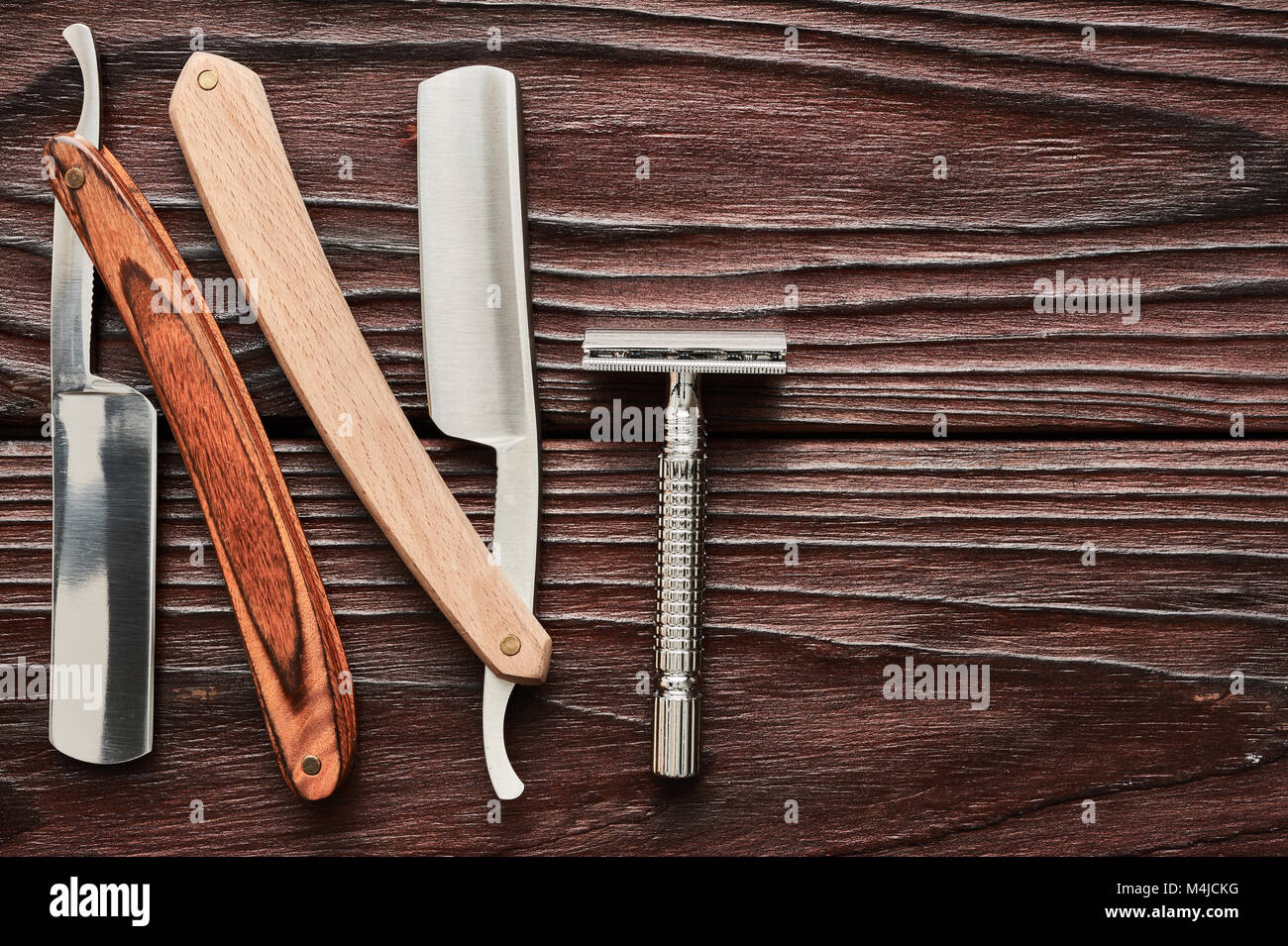 Vintage barber shop razor tools on wooden background Stock Photo - Alamy