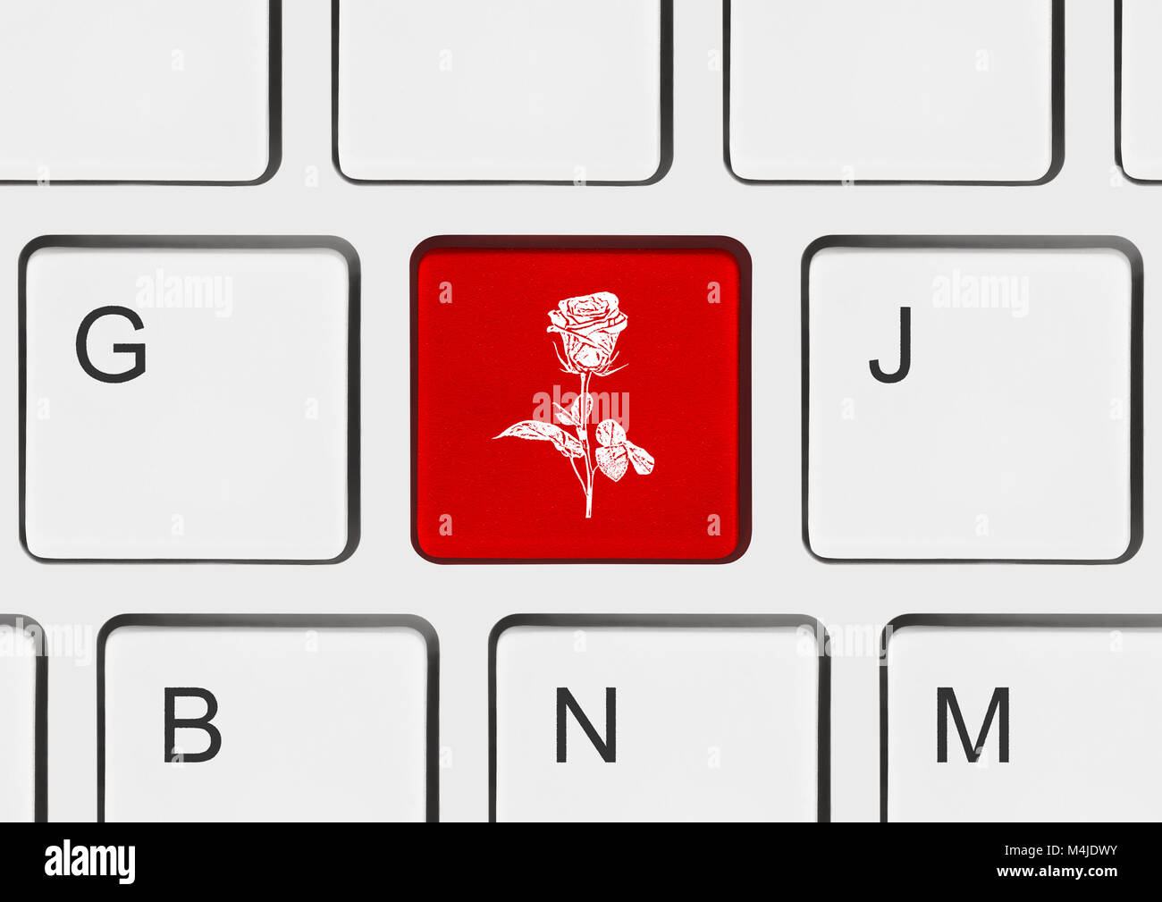 Computer keyboard with flower key Stock Photo - Alamy