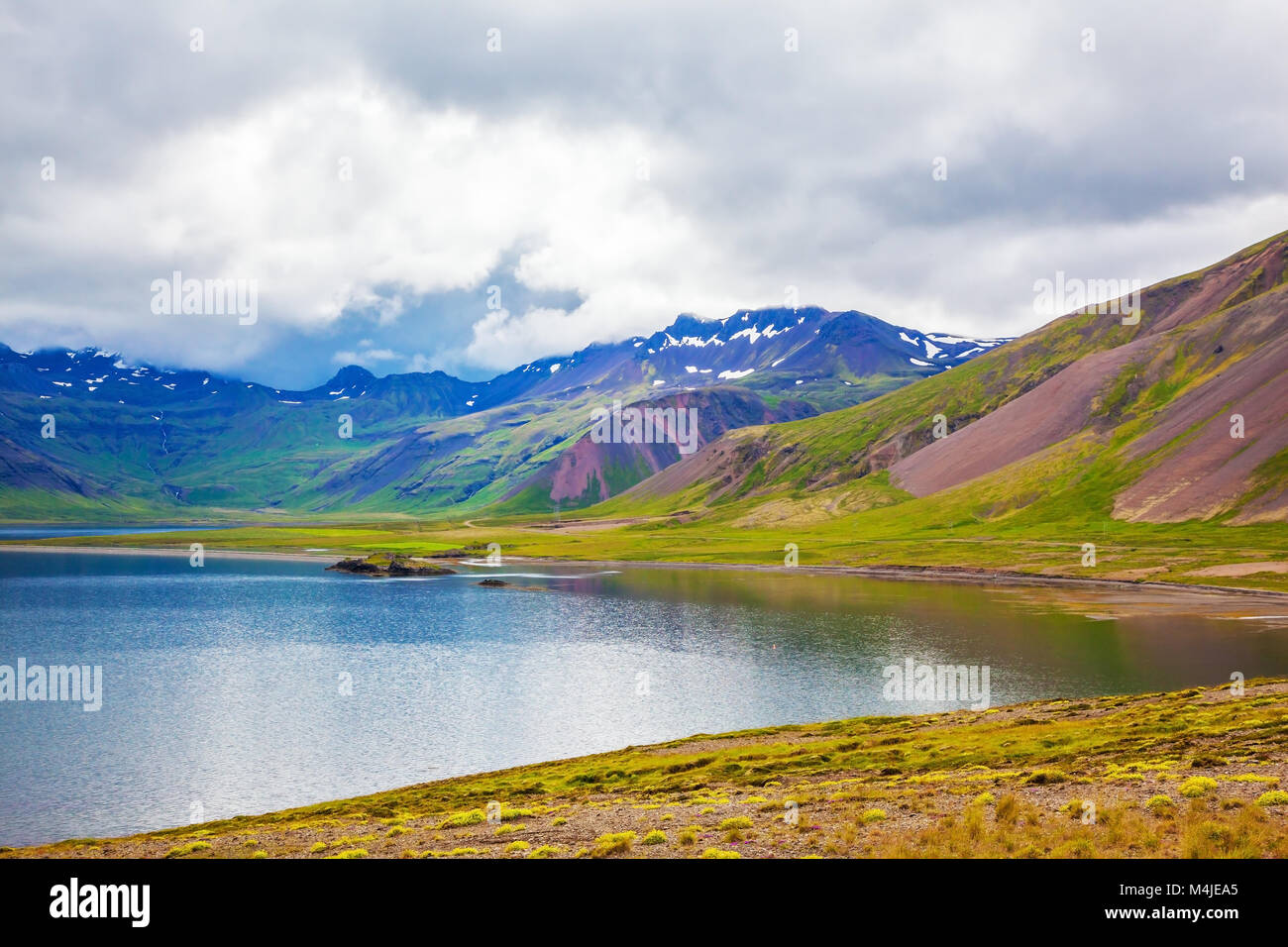 Smooth water of the cold fjord Stock Photo - Alamy