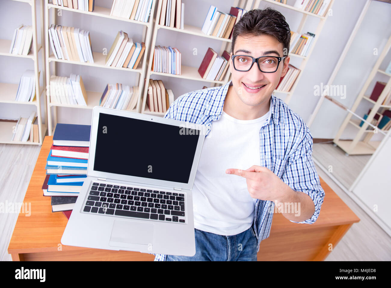 Young student with books preparing for exams Stock Photo - Alamy