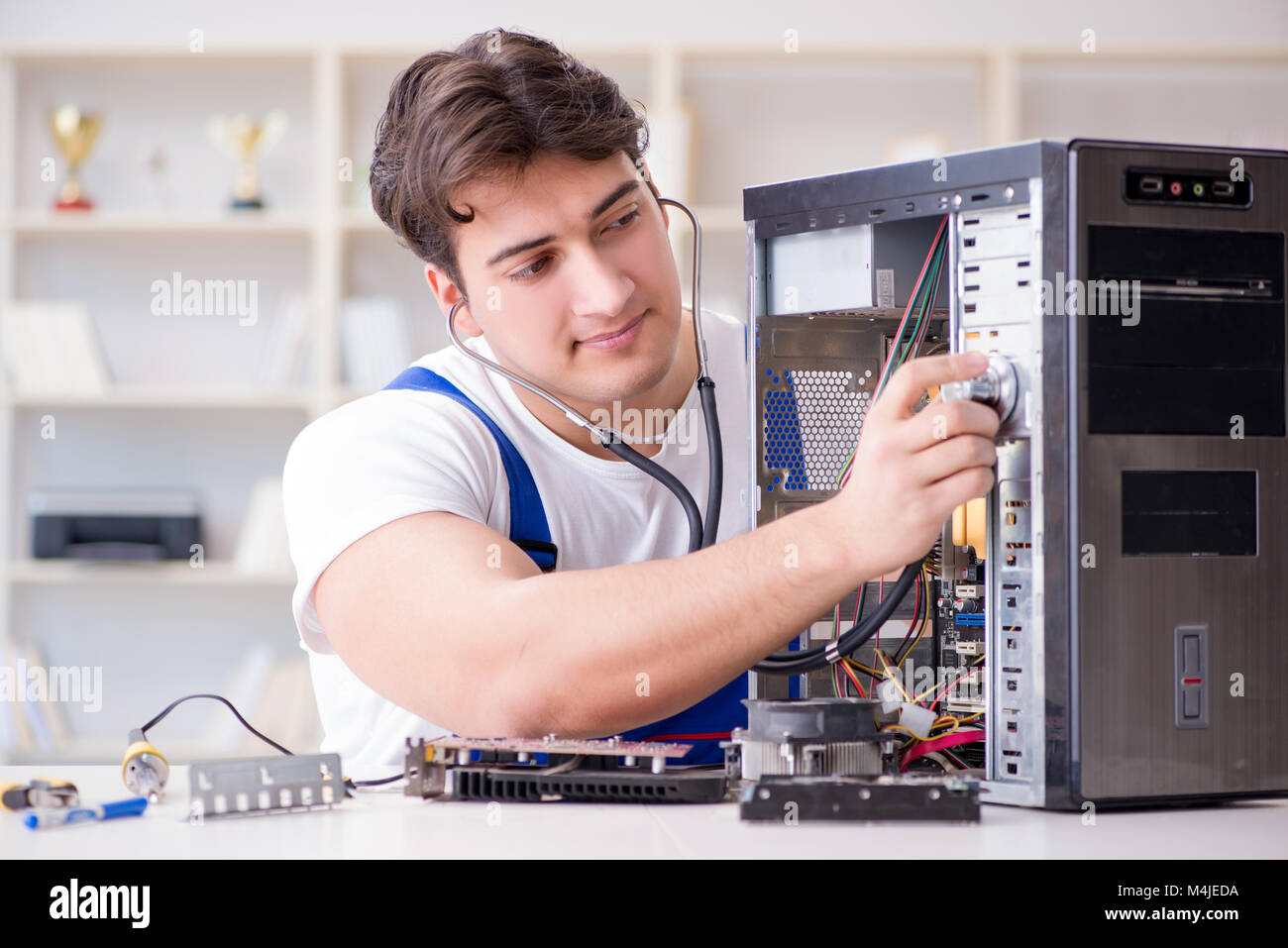 Computer repairman repairing desktop computer Stock Photo - Alamy