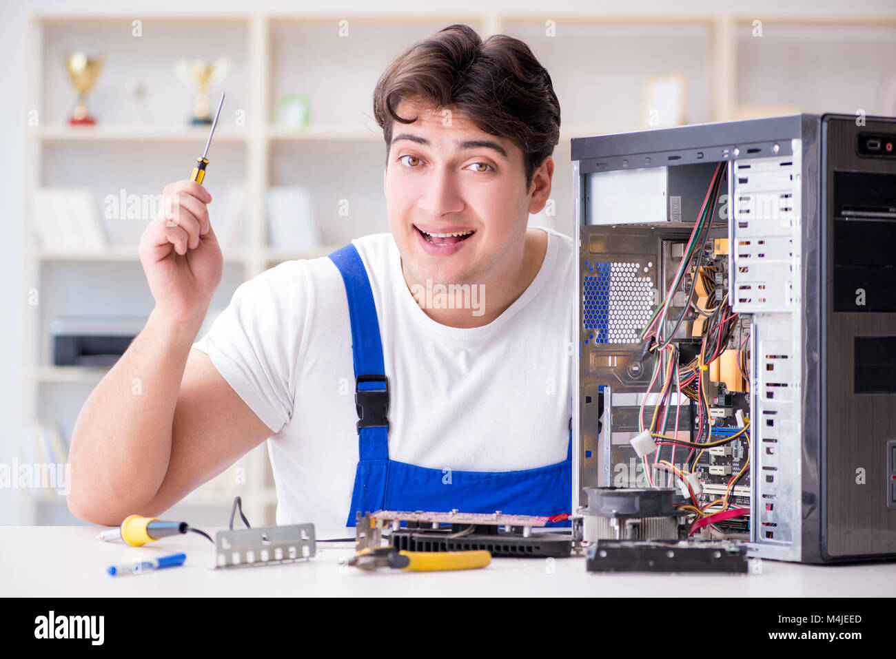 Computer repairman repairing desktop computer Stock Photo - Alamy