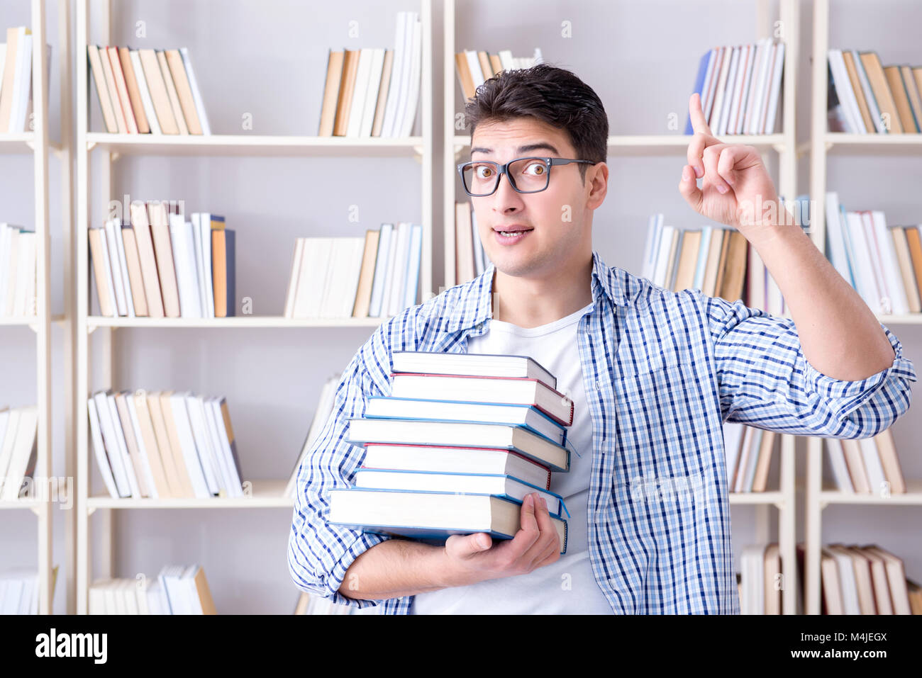 Young student with books preparing for exams Stock Photo - Alamy